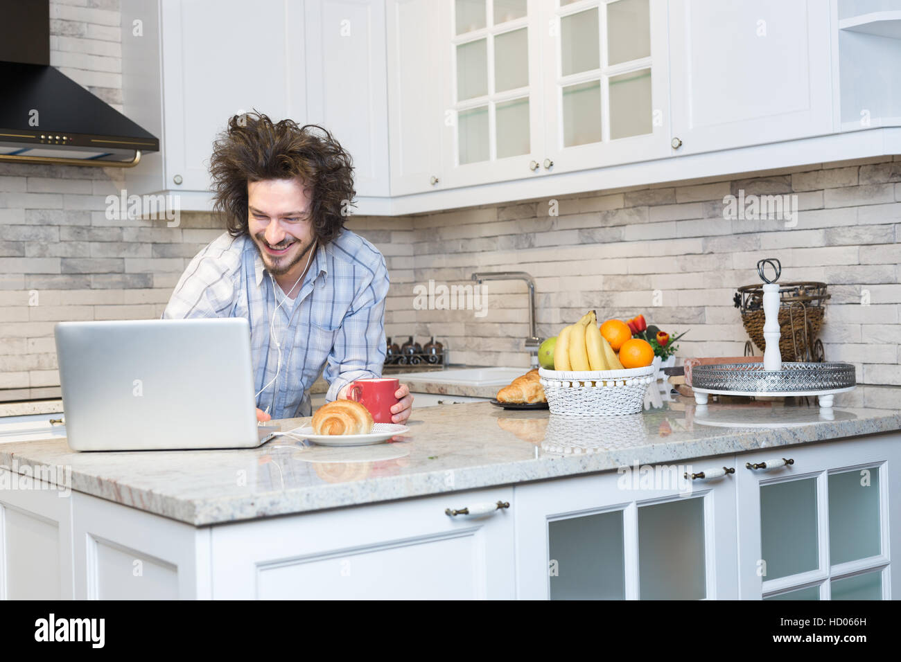 Man Eating Breakfast Using Laptop, Man in kitchen drinking coffe Stock ...