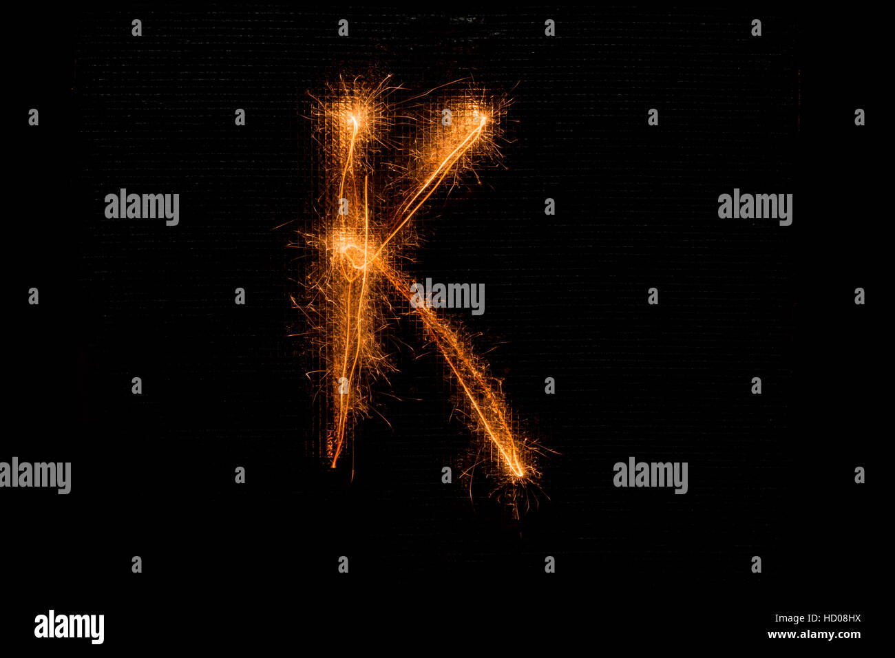 Letter K made of sparklers on black Stock Photo - Alamy