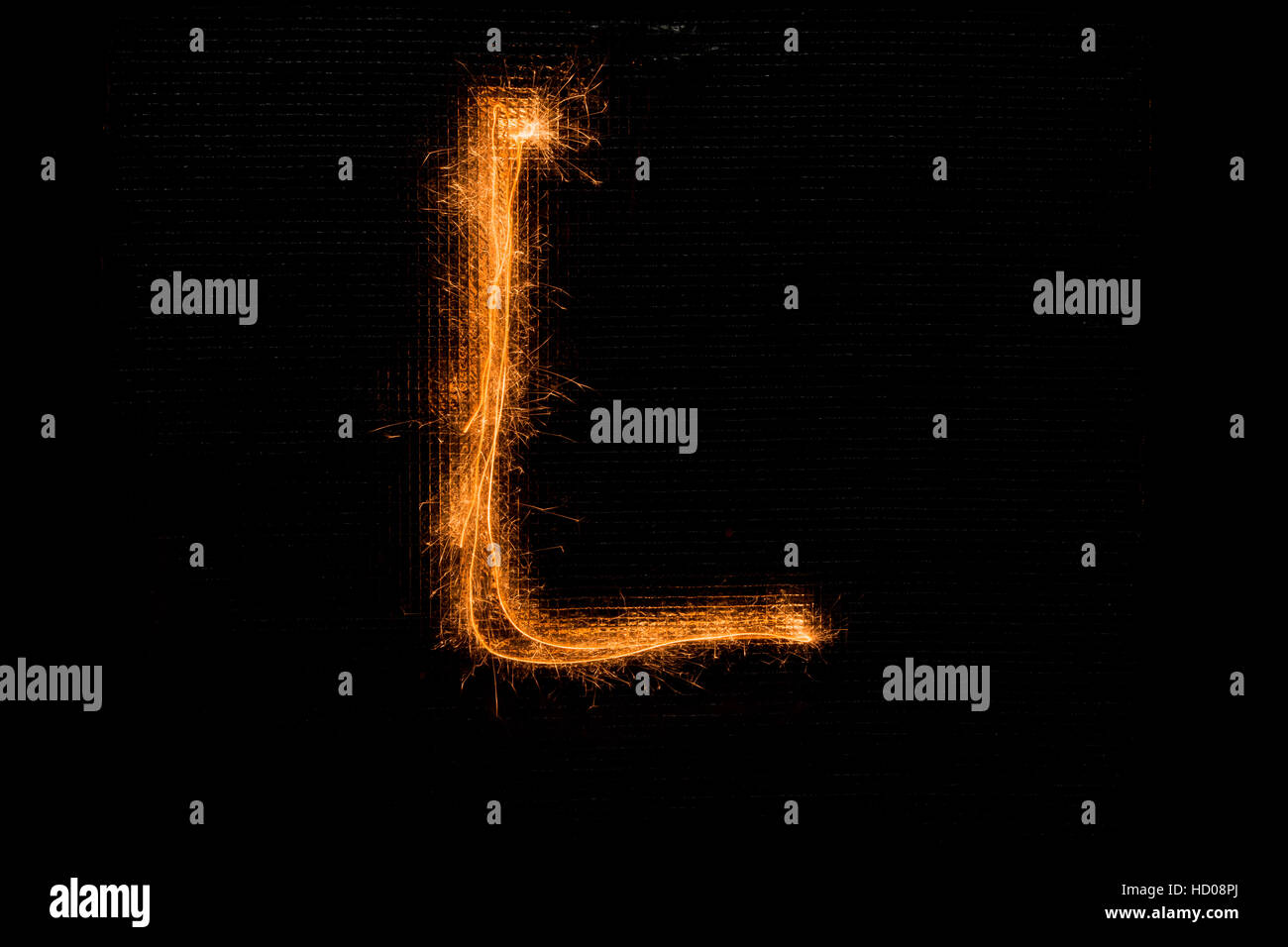 Letter L made of sparklers on black Stock Photo - Alamy