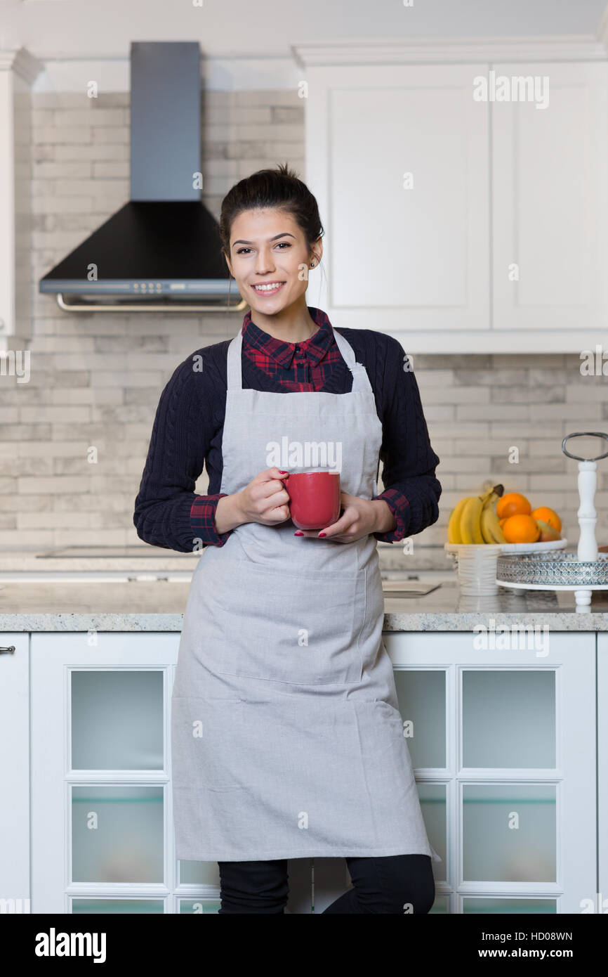 A beautiful woman in her kitchen during her breakfast Stock Photo - Alamy