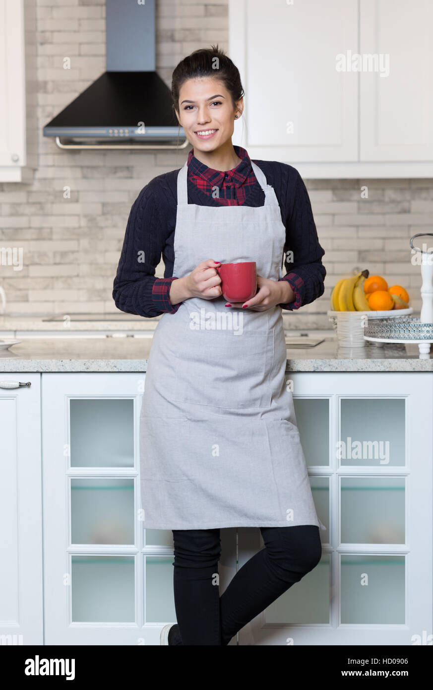 A beautiful woman in her kitchen during her breakfast Stock Photo - Alamy