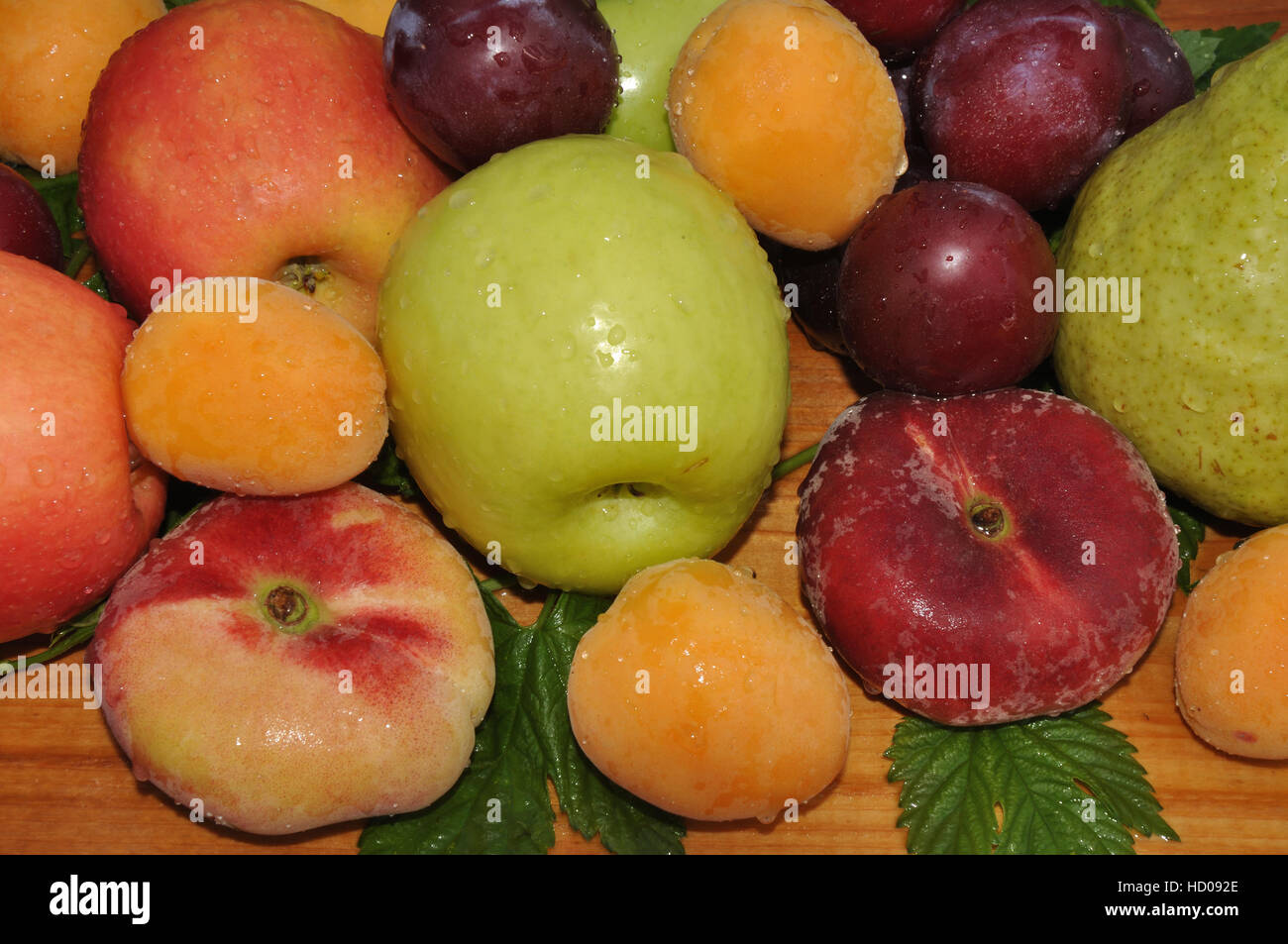 Fresh and ripe fruit on a wooden countertop Stock Photo - Alamy