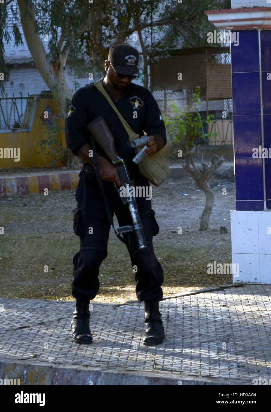 Hyderabad, Pakistan. 09th Dec, 2016. A police man reloading his tear ...