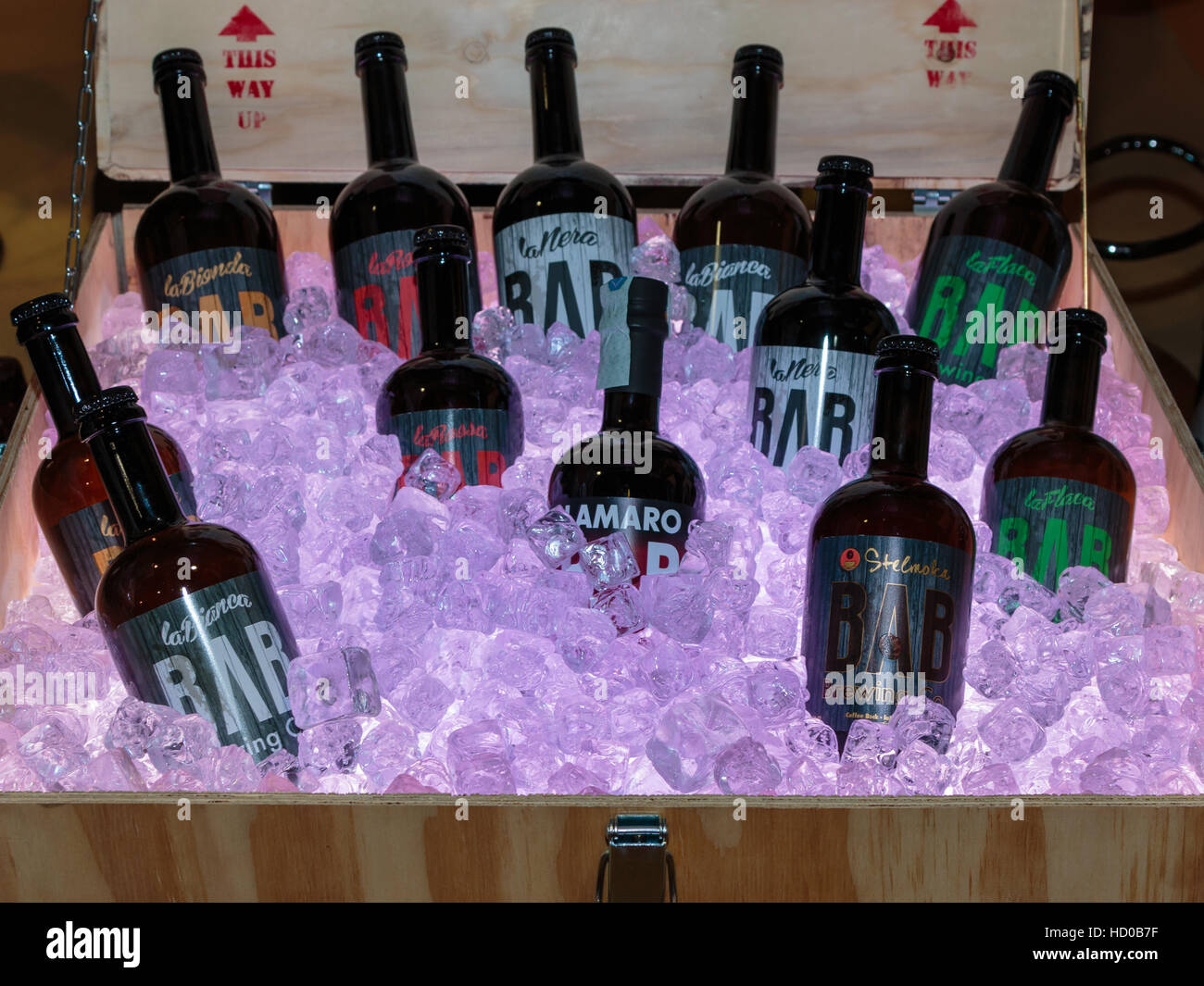 Beer Bottles Inside Wooden Box Filled with Ice Cubes in Purple Light ...
