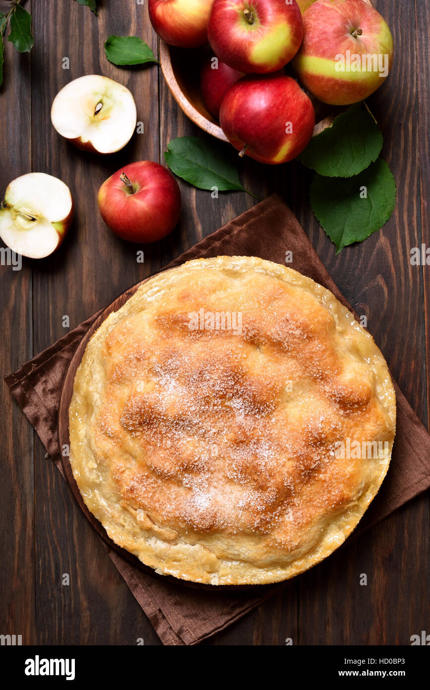 Apple pie and fresh fruits on wooden background, top view Stock Photo ...