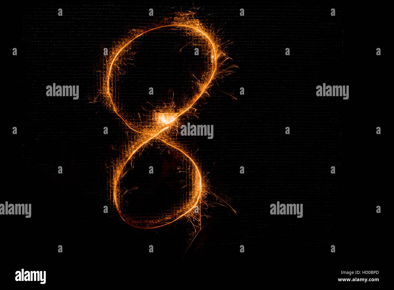 Number 8 made of sparklers on black Stock Photo - Alamy