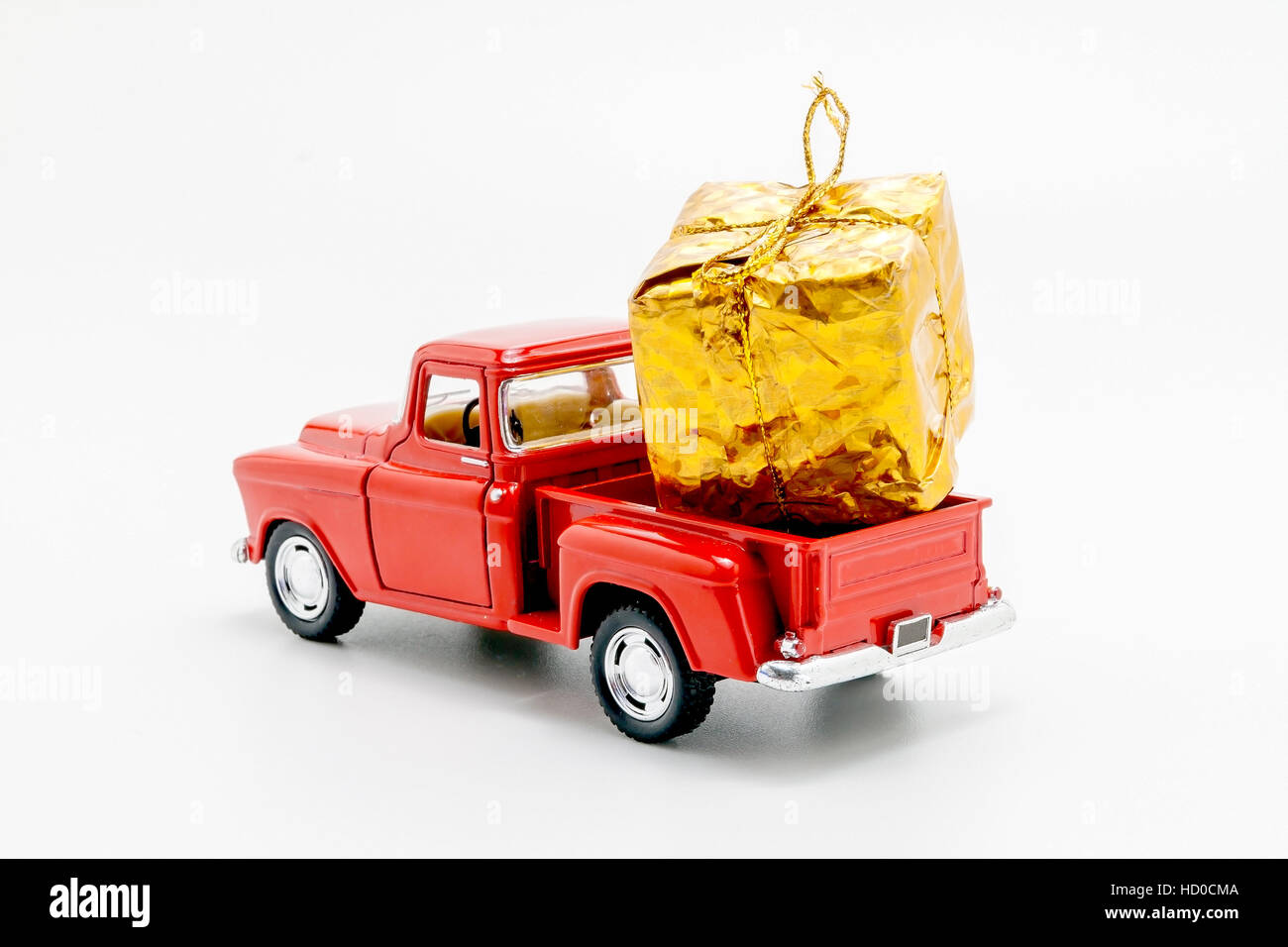 red retro car pickup with yellow gift box isolated Stock Photo - Alamy