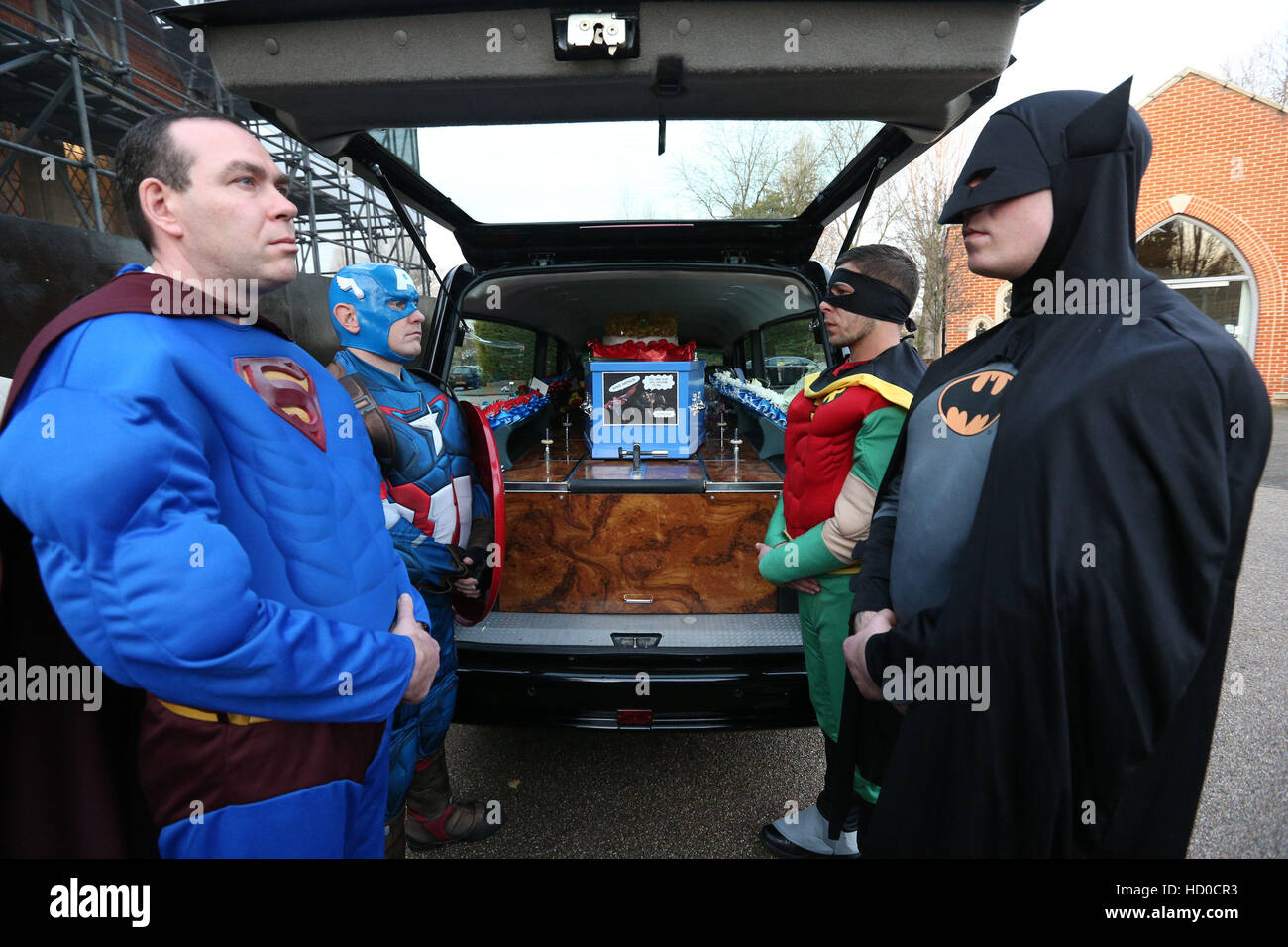 Pallbearers dressed as superheroes prepare to carry the coffin of 18 ...