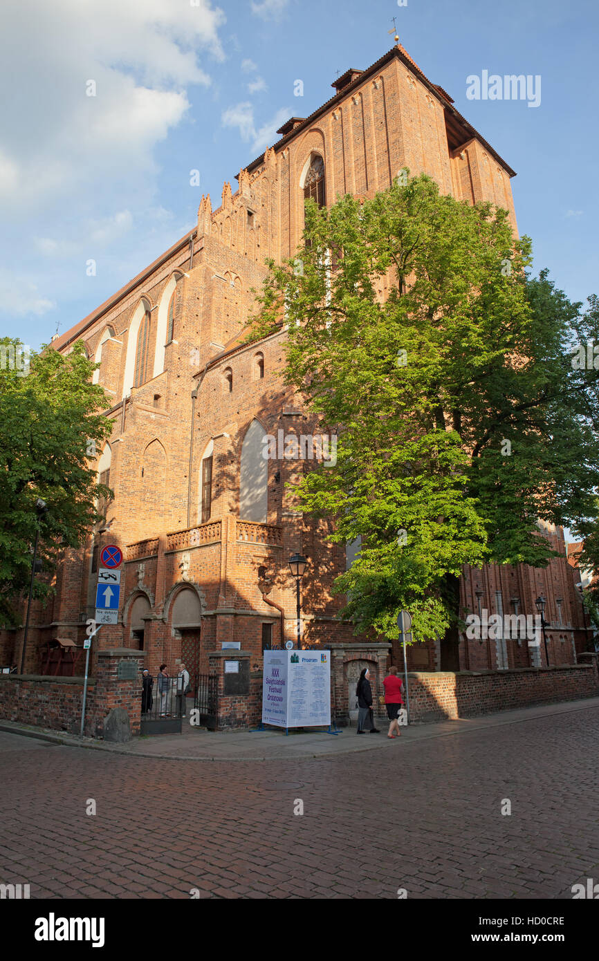 Torun, Poland, sunset at Gothic Cathedral Basilica of St. John the ...
