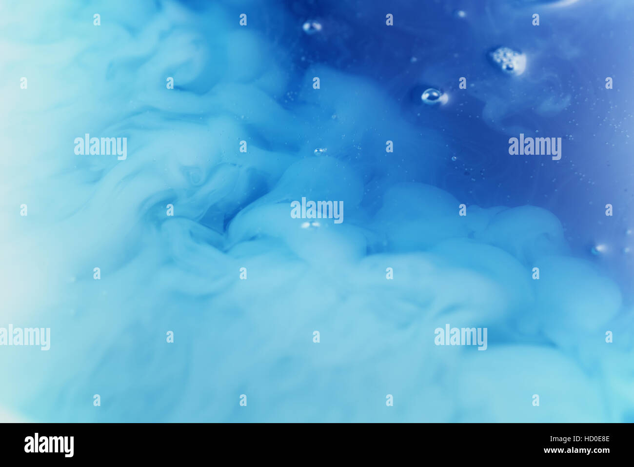 blue and white inks mixing together from above Stock Photo - Alamy