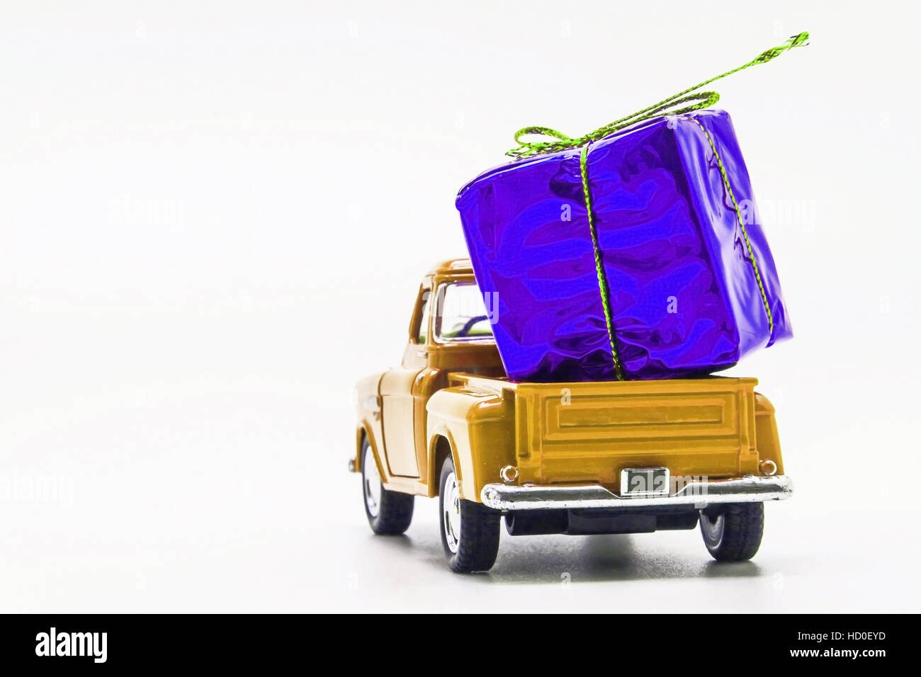 yellow retro car pickup violet gift box isolated Stock Photo - Alamy