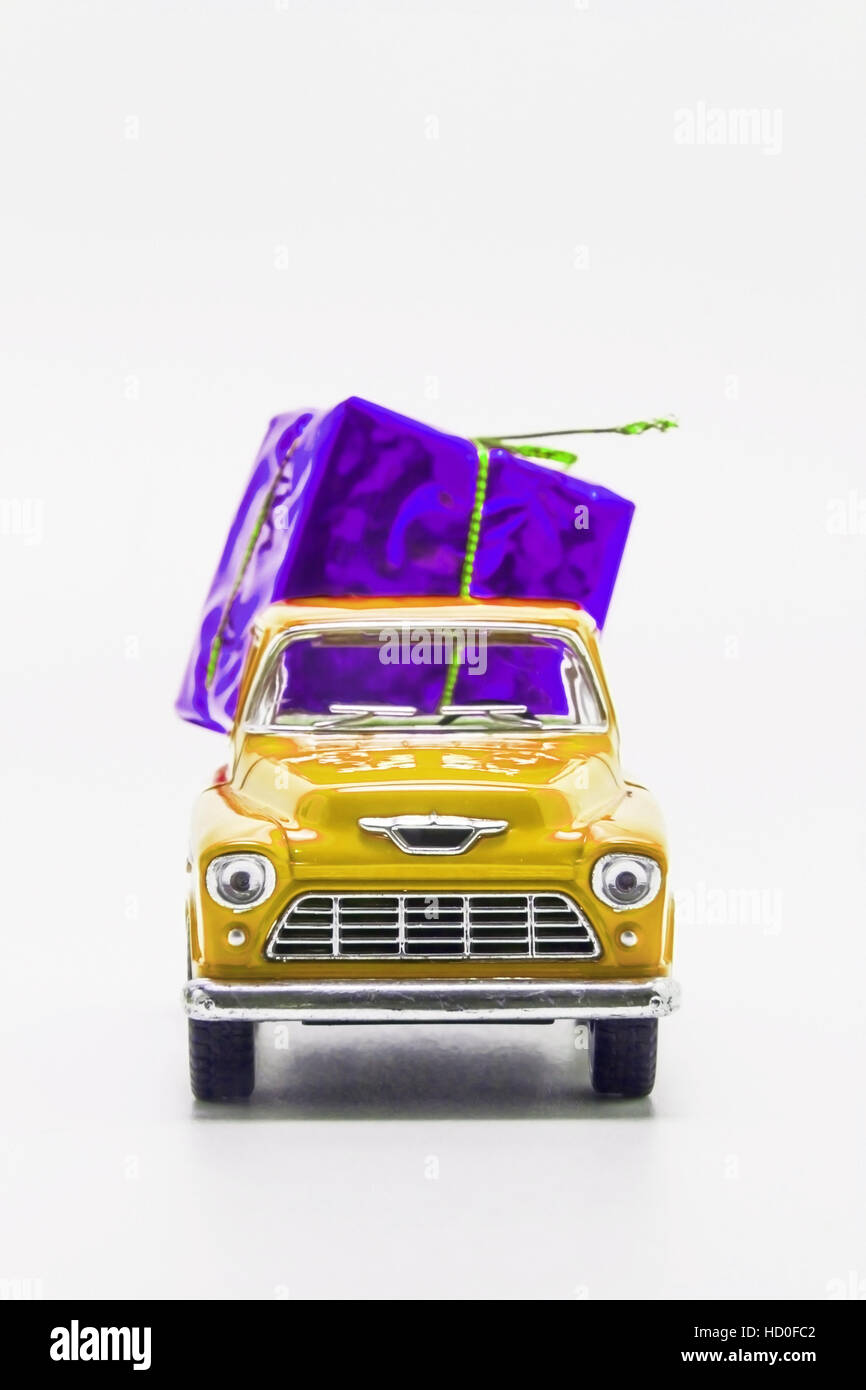 yellow retro car pickup violet gift box isolated Stock Photo - Alamy