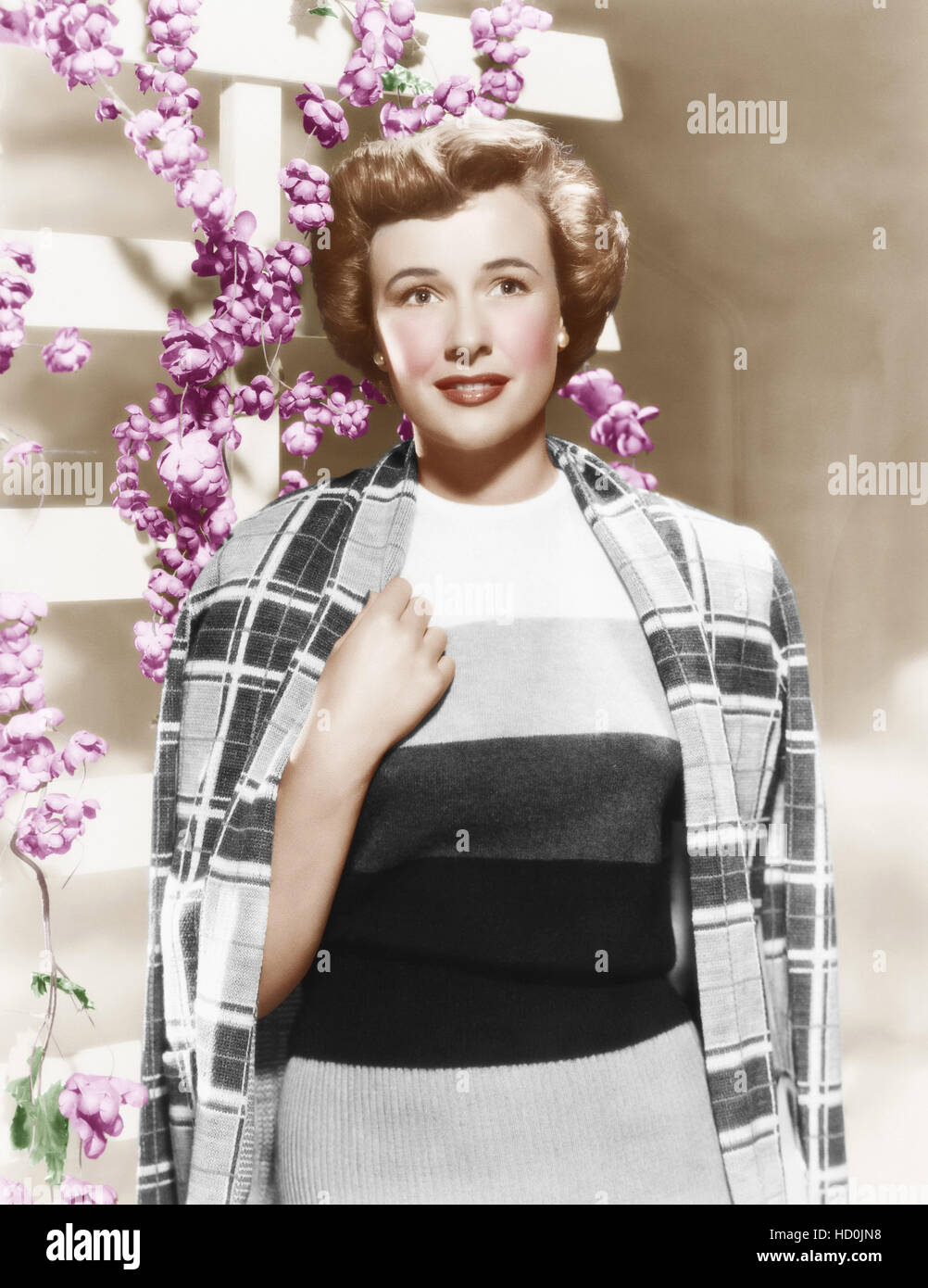 Phyllis Thaxter models a short sleeve cashmere sweater and wool plaid ...