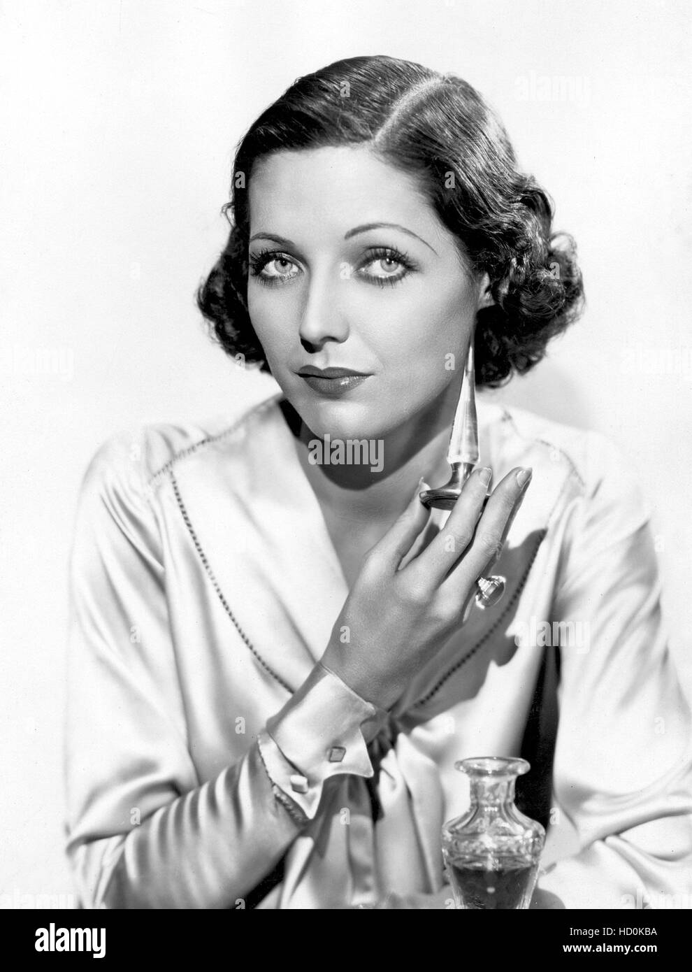 Adrienne Ames, demonstrating perfume application, 1933 Stock Photo - Alamy