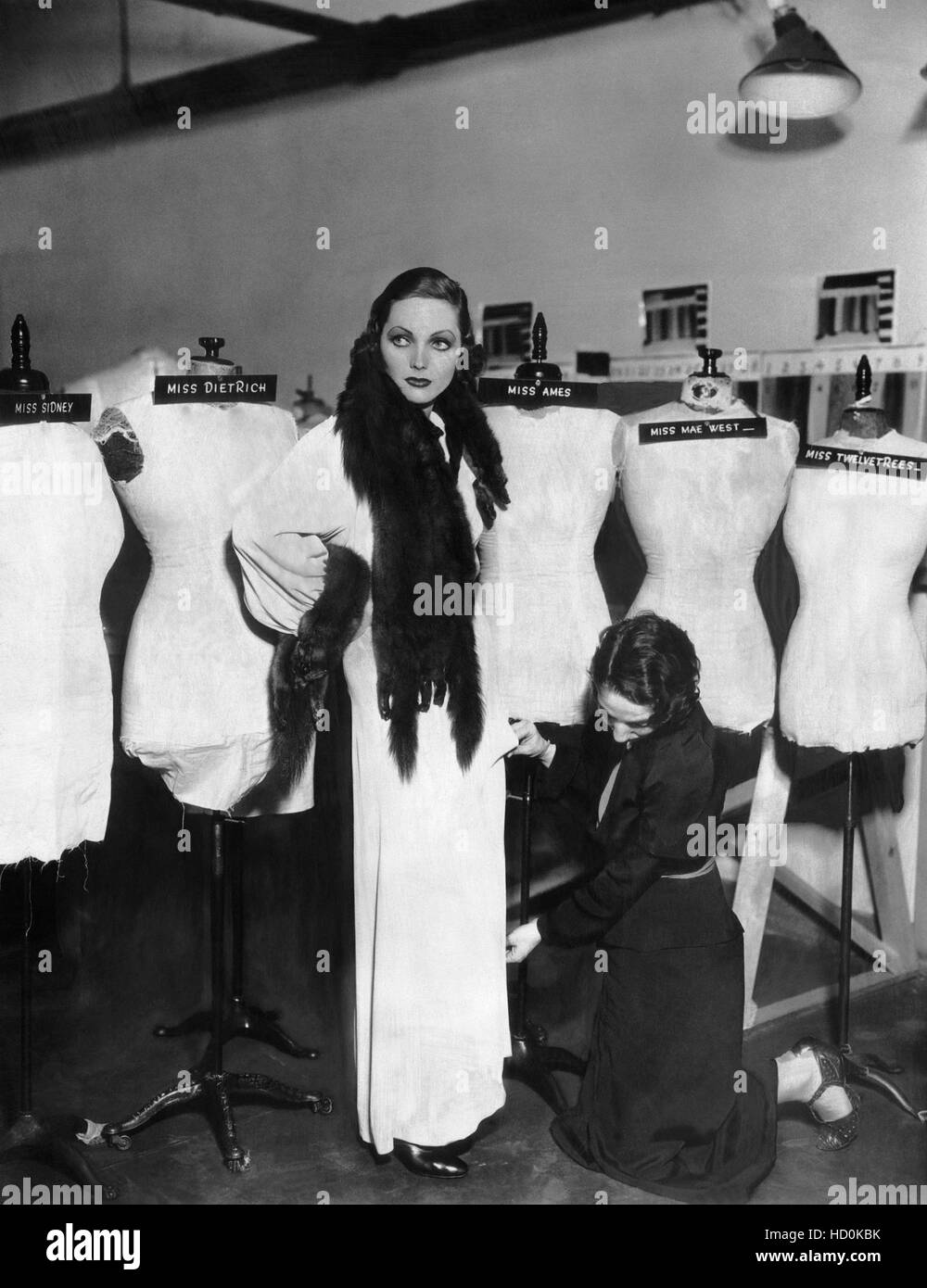 Adrienne Ames, being fitted in the Paramount costume shop (in ...