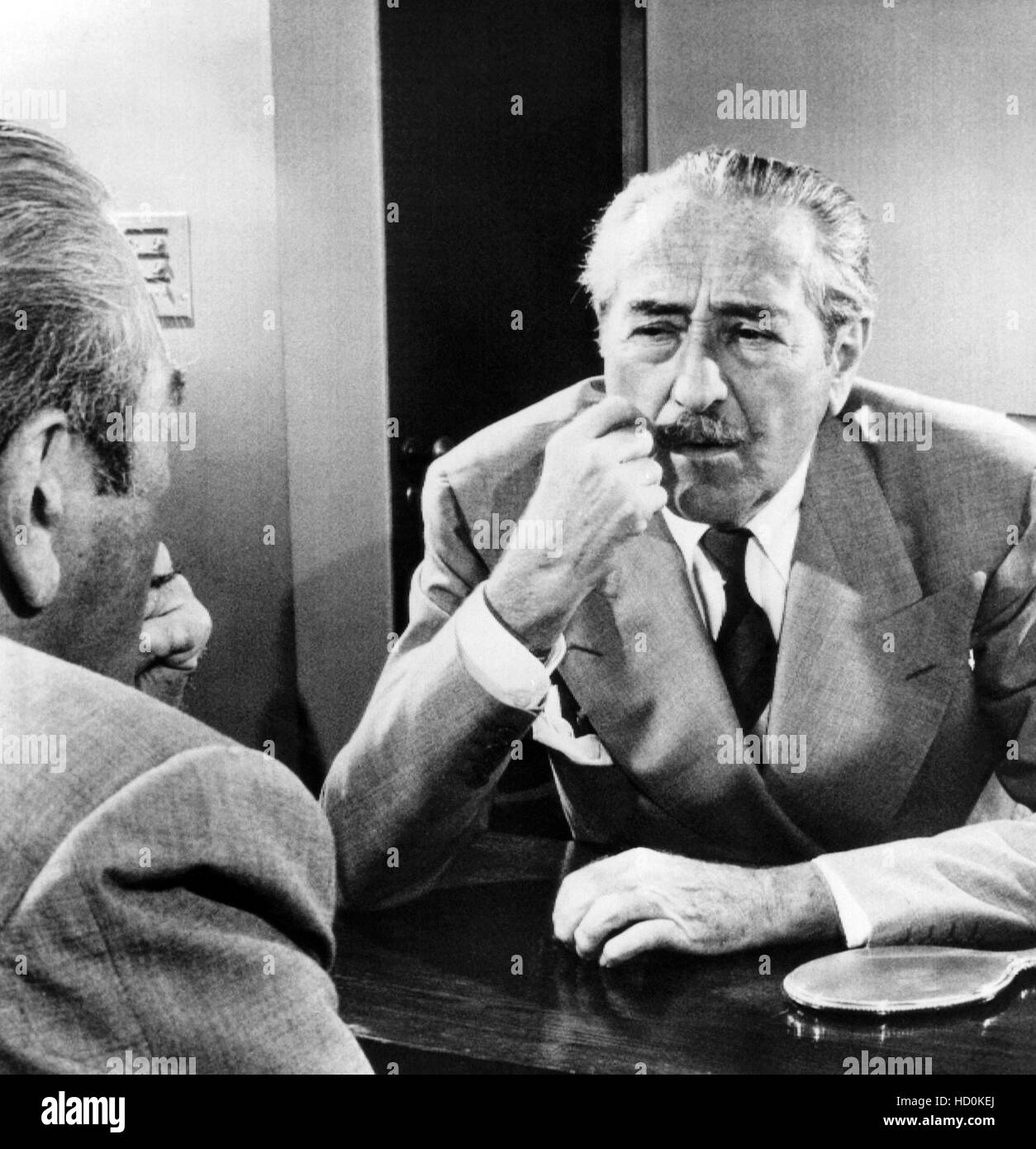Adolphe Menjou examining his moustache before shaving it off for the ...