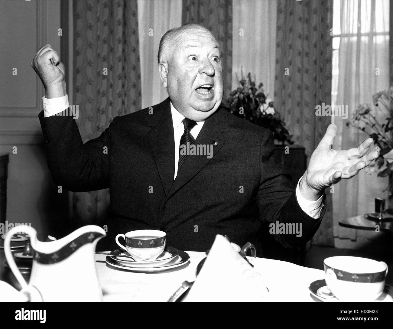 PSYCHO, director Alfred Hitchcock wielding his butter knife to ...