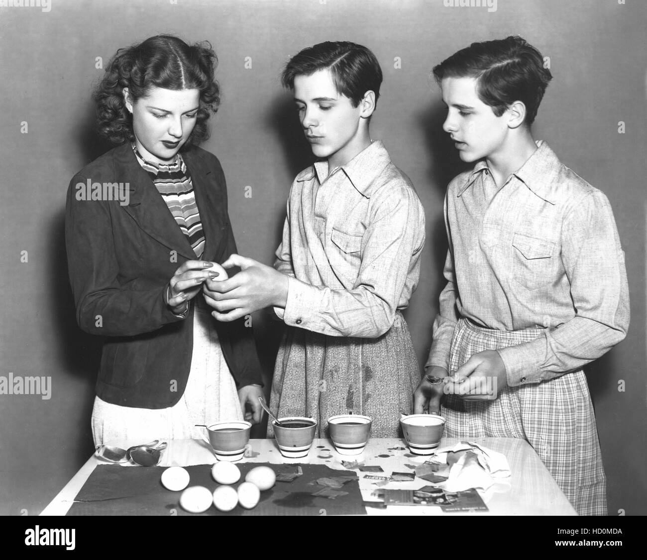 Ann Sheridan with Billy and Bobby Mauch, making Easter eggs during the ...