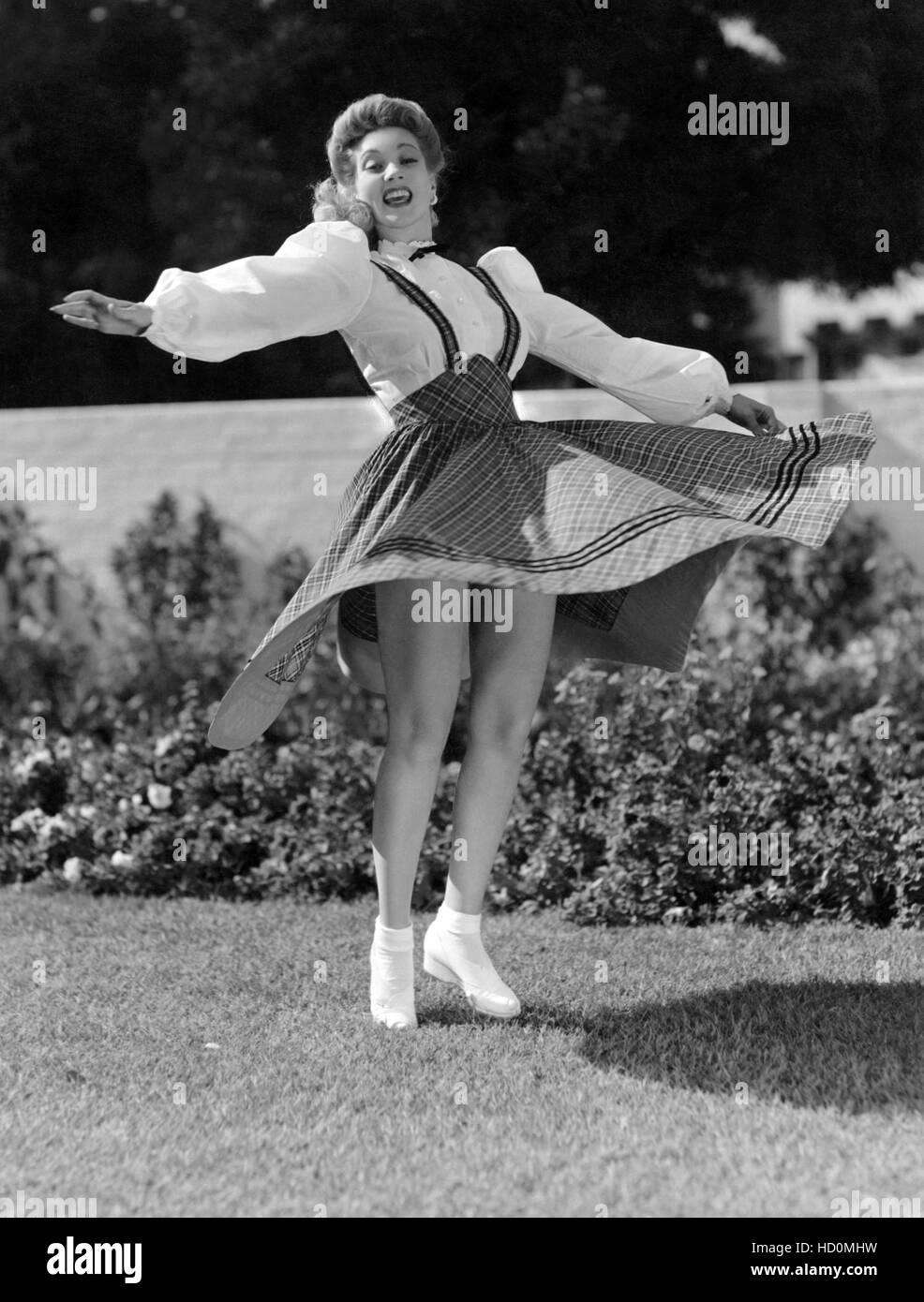 Ann Sothern frolicking in the backyard of her Beverly Hills home, 1942 ...