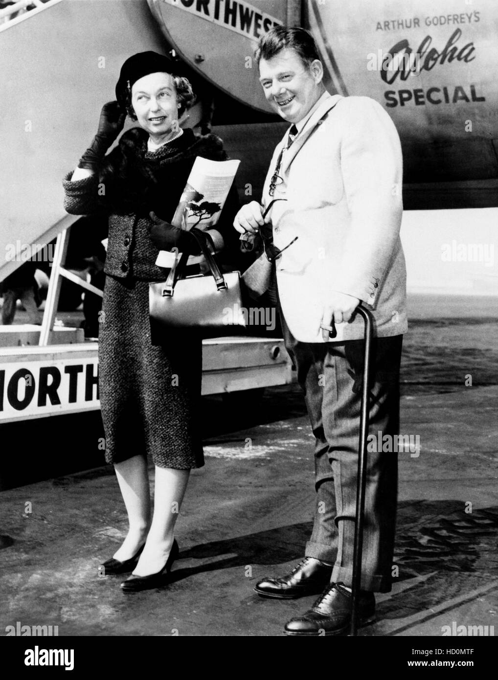 Arthur Godfrey, right, and his wife, Mary Godfrey, boarding a plane in ...