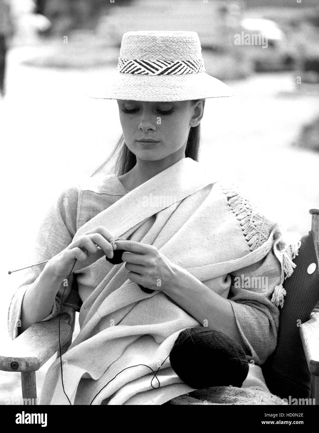 AUDREY HEPBURN knits while waiting on-location for THE UNFORGIVEN, 1959 ...