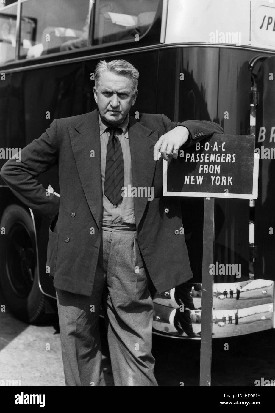 Director Brian Desmond Hurst arriving at London Airport, 1952 Stock ...