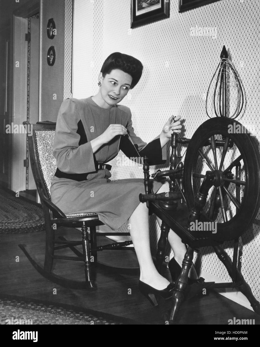 Cass Daley at home with her antique spinning wheel, 1947 Stock Photo ...
