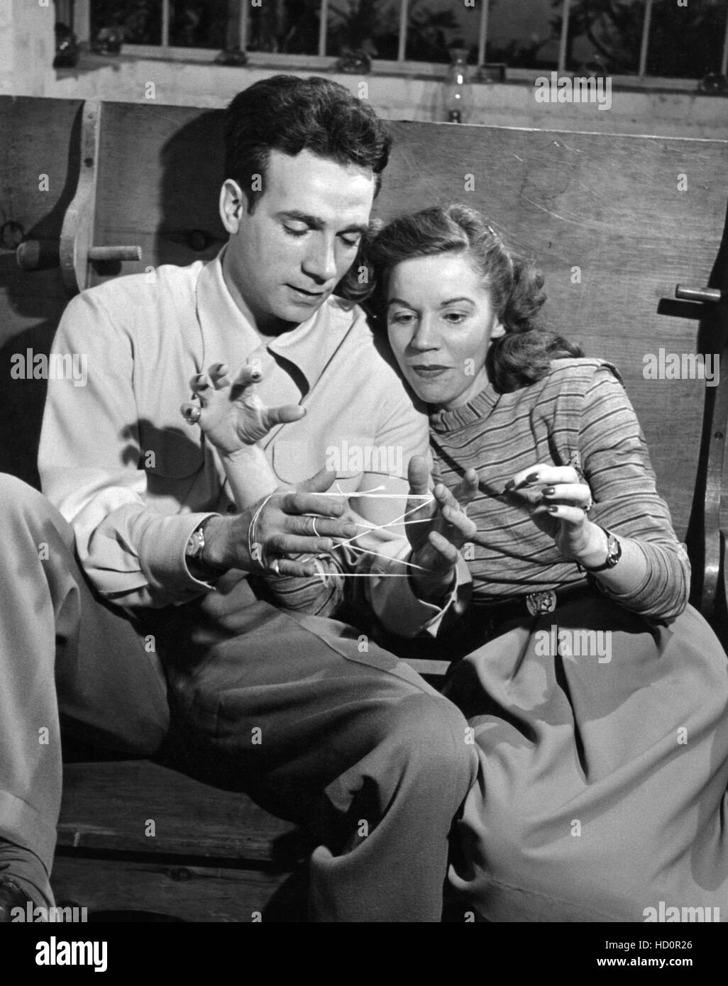From left: Dane Clark playing cat's cradle with wife, Margot Yoder, ca ...