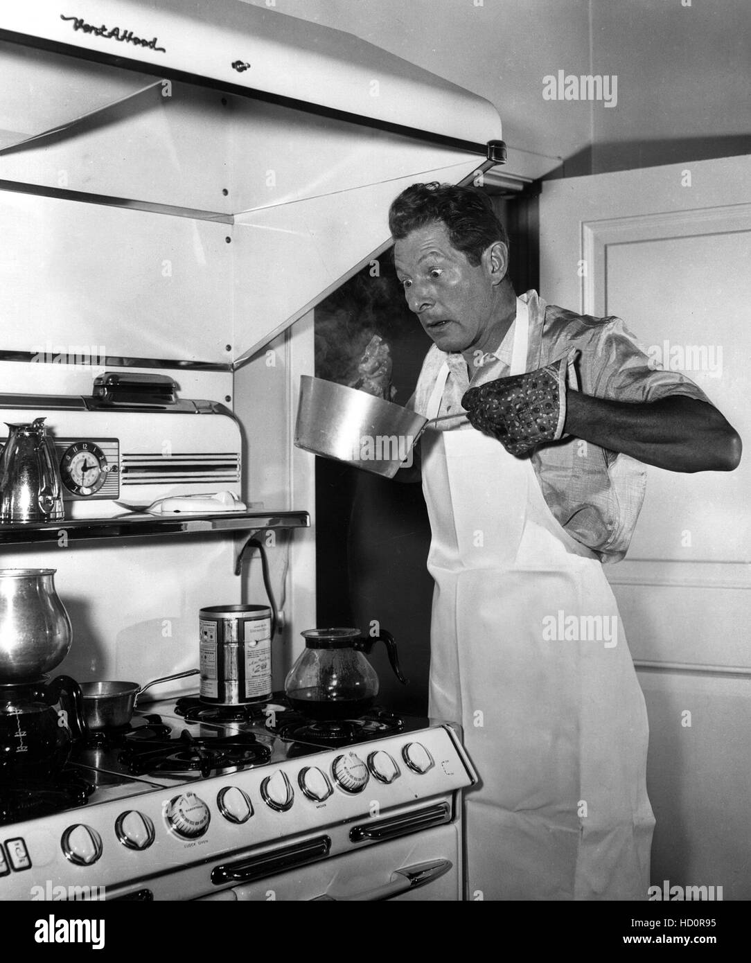 DANNY KAYE has a cooking mishap in the kitchen, 1954 Stock Photo - Alamy