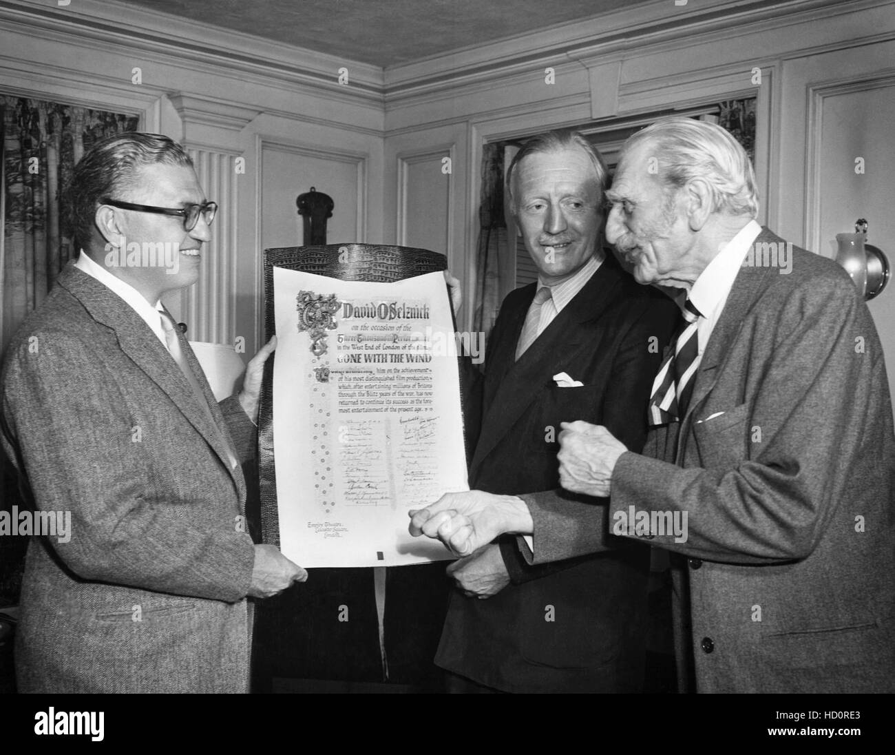 David O. Selznick, Robert H. Hadow, Sir C. Aubrey Smith, presenting a ...