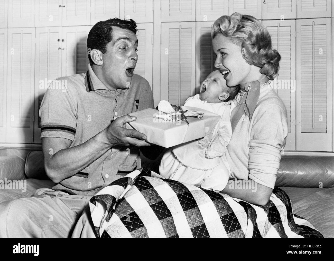 DEAN MARTIN presents his 3 month son DINO MARTIN with a gift while wife ...