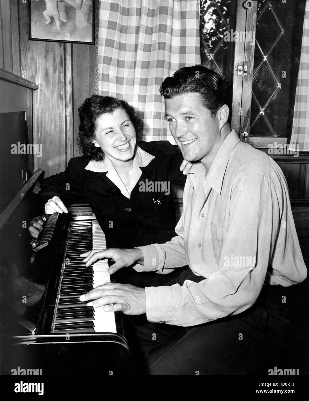 From left: Lillian and Dennis Morgan playing piano at home, ca. 1944 ...