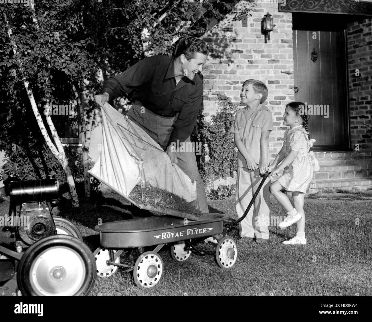 From left: Dennis Morgan doing yard work with his son and daughter ...