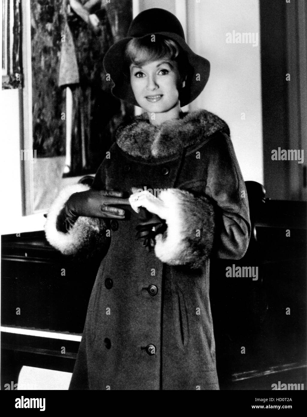 Debbie Reynolds, modeling a hat by John Frederics and a fleece coat ...