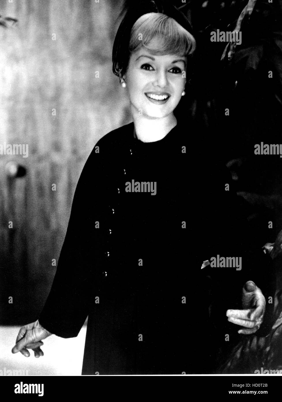 Debbie Reynolds, modeling a velvet feathered hat by John Frederics ...