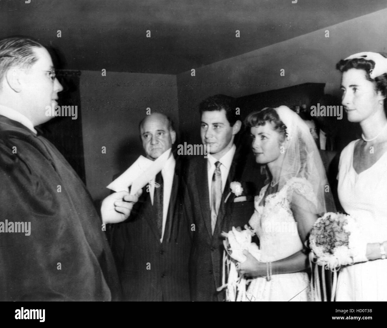 Judge Lawrence Cooke reading the wedding ceremony to best man Milton ...