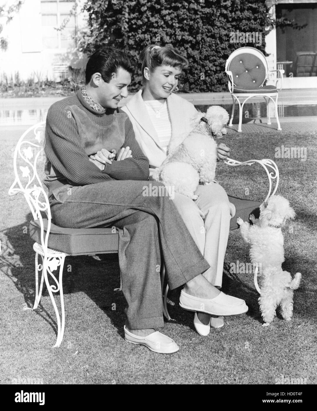 Eddie Fisher (left) and Debbie Reynolds at home with their toy poodles ...