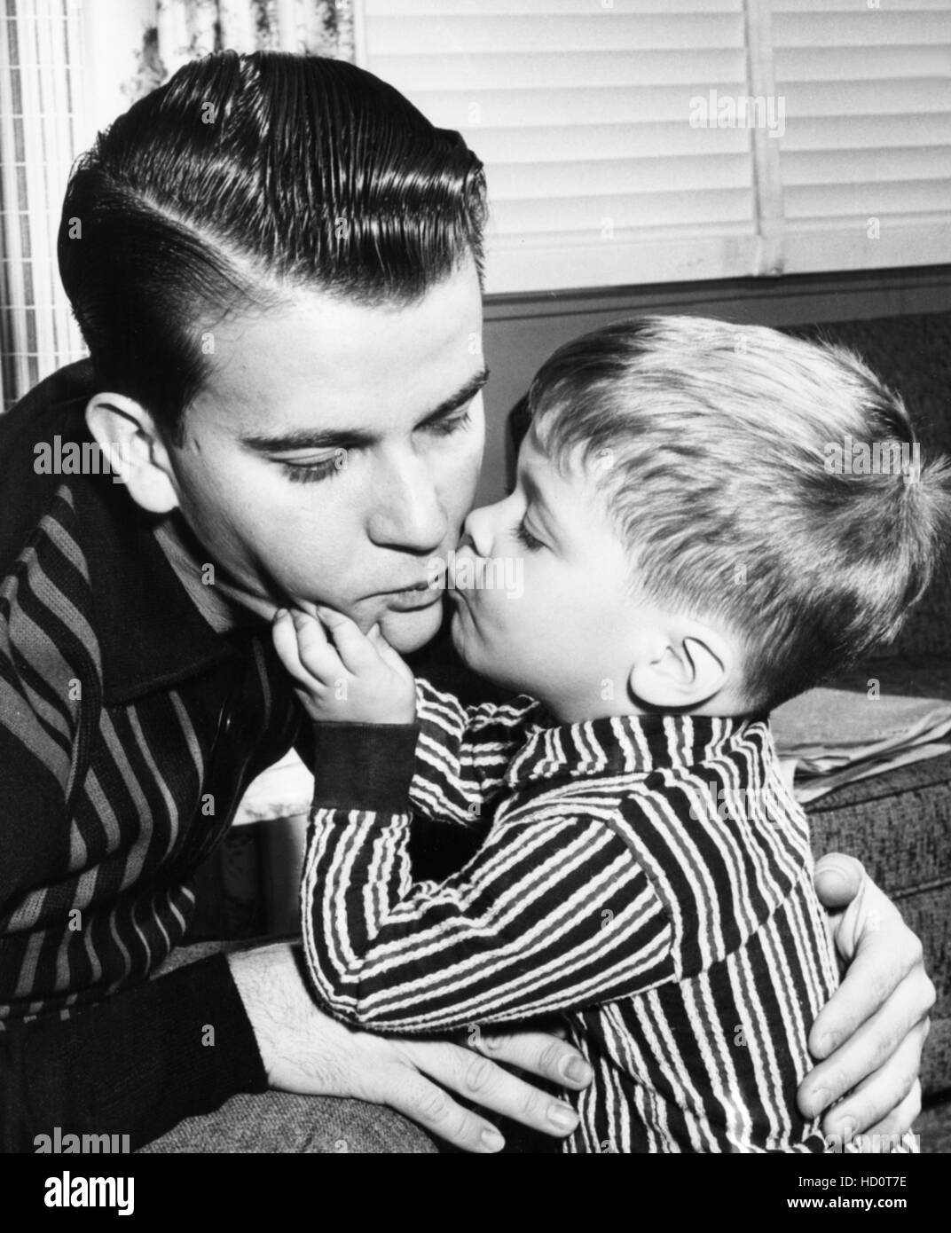 Dick Clark, with son Richard Augustus Clark II, at home, ca. 1959 Stock ...