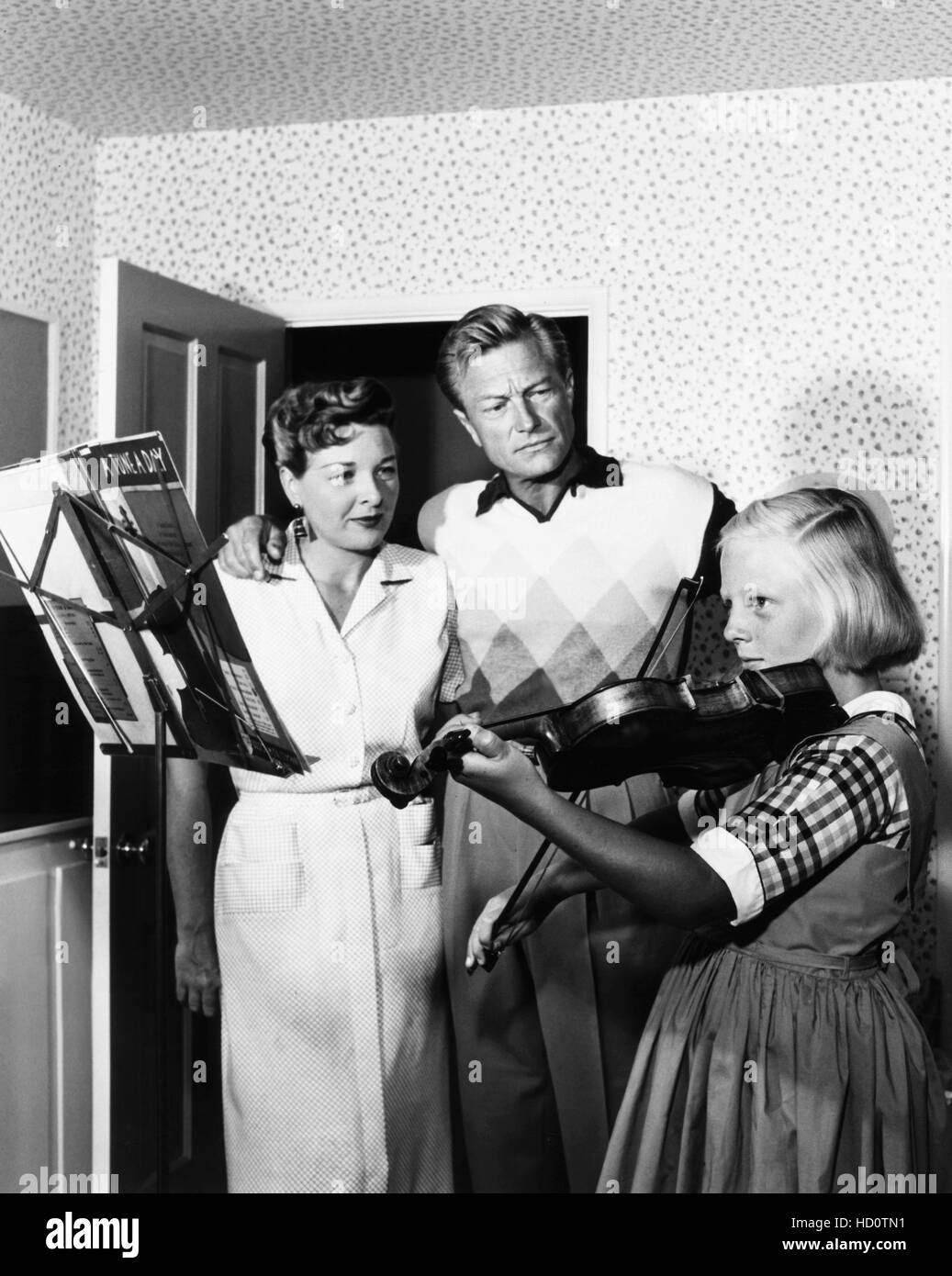 From left, Evelen Ankers, Richard Denning, making sure their daughter ...