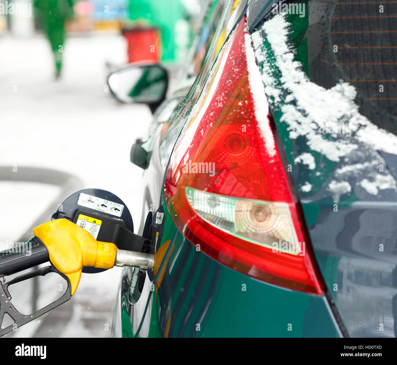 Car refueling on a petrol station in winter closeup Stock Photo - Alamy