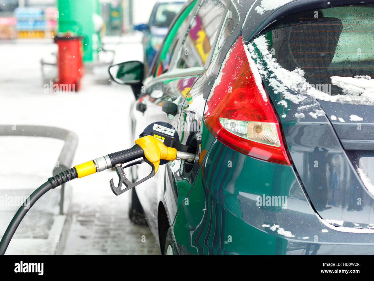 Car refueling on a petrol station in winter closeup Stock Photo - Alamy