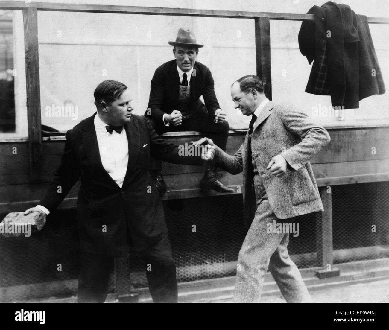 Roscoe 'Fatty' Arbuckle, (holding brick), sparring with Norman Selby ...