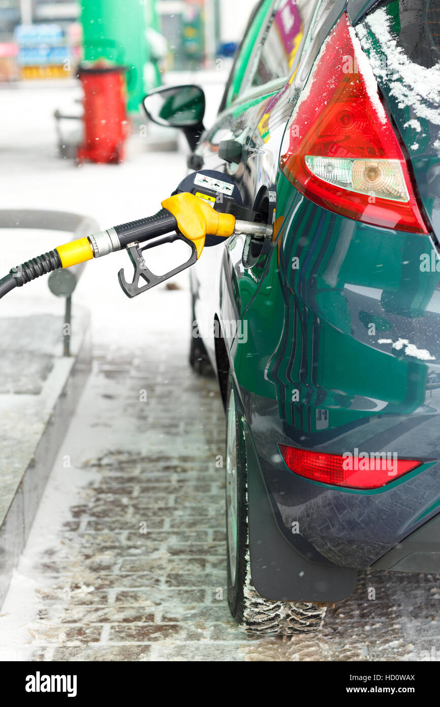 Car refueling on a petrol station in winter closeup Stock Photo - Alamy