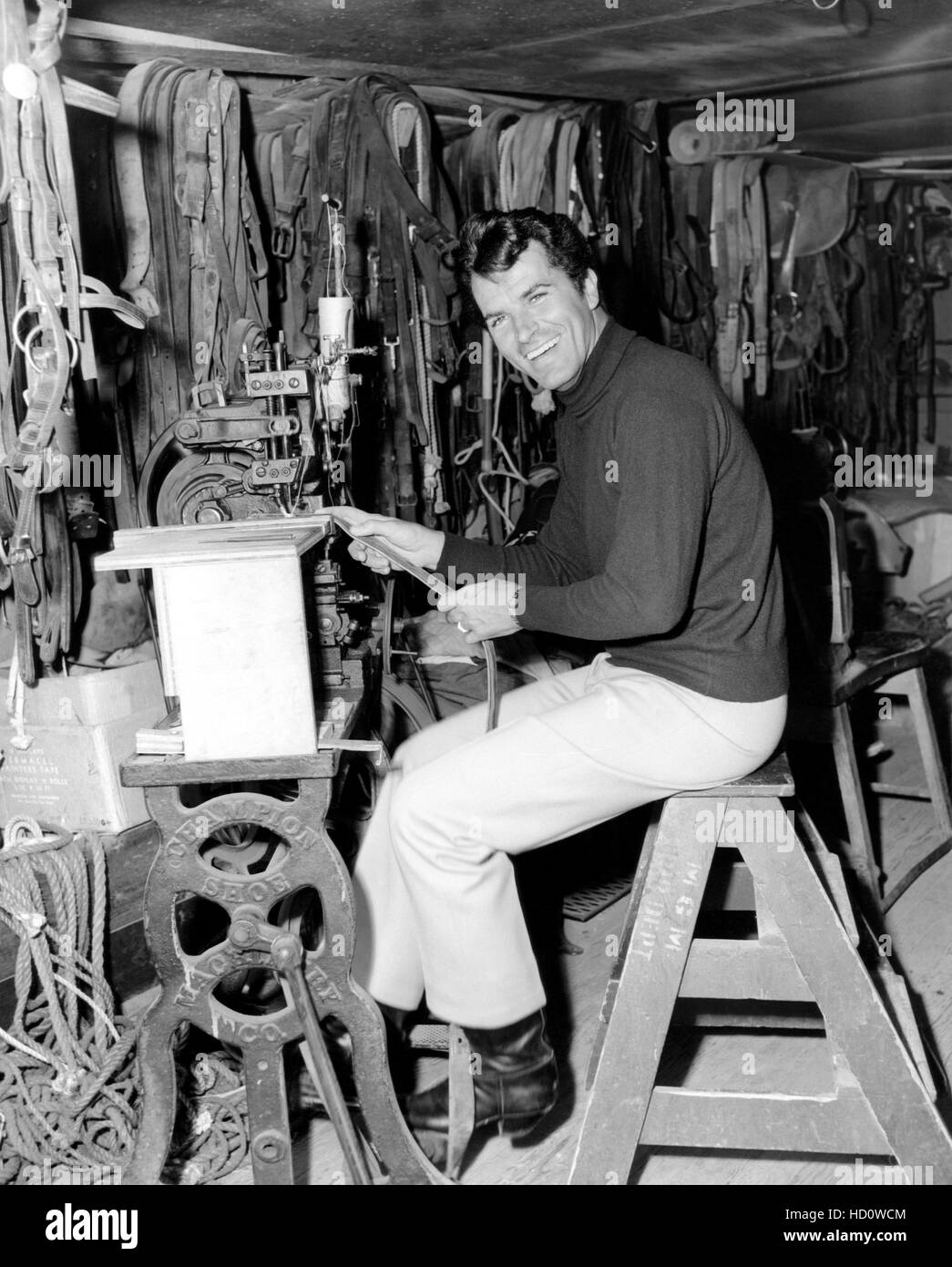 Fernando Lamas sewing leather belt, ca. 1953 Stock Photo - Alamy