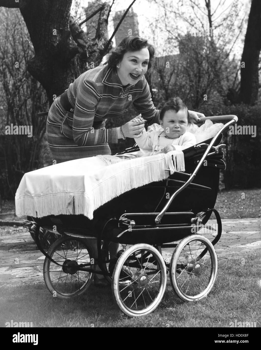 Googie Withers, with one of her three children, early 1950s Stock Photo ...