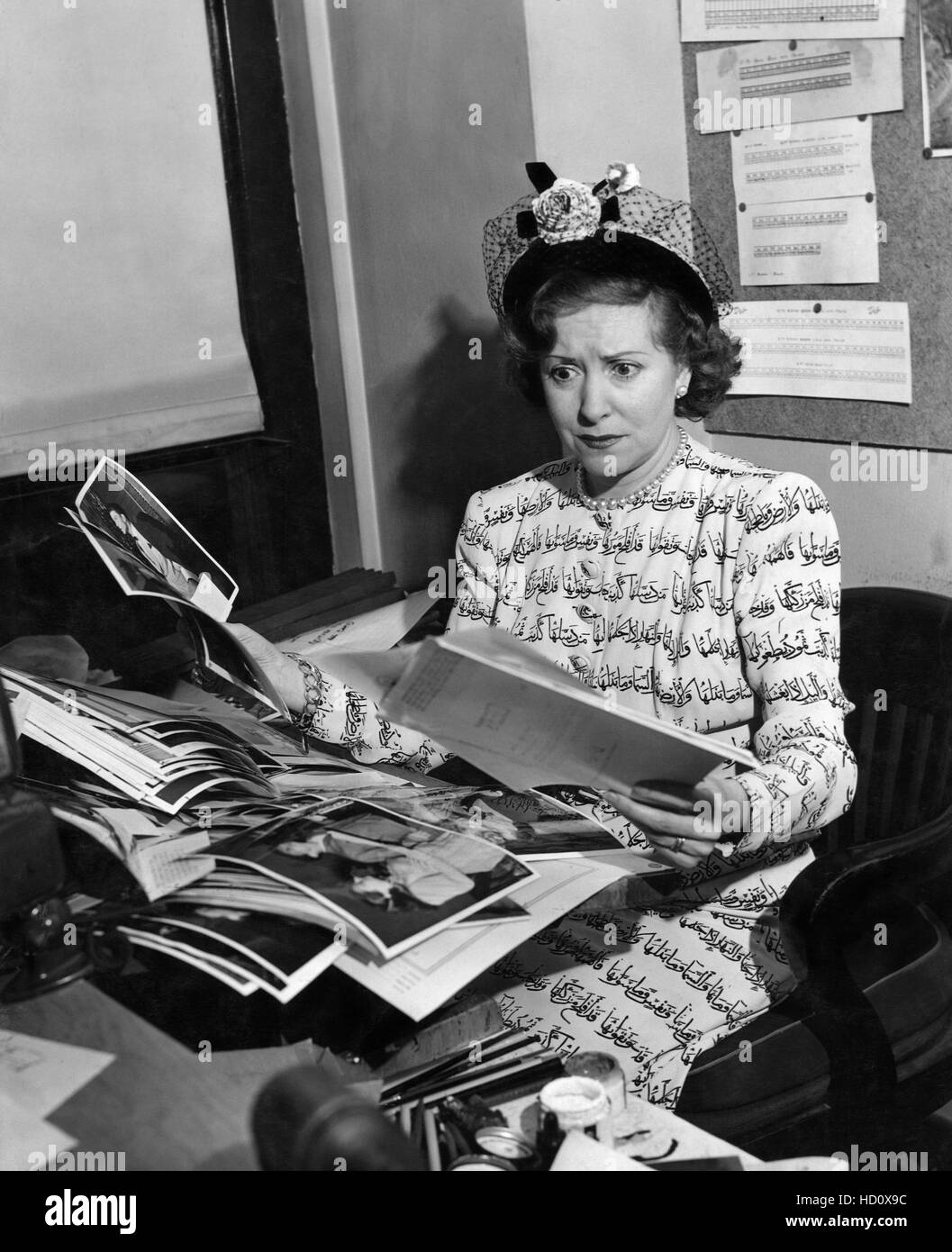 Gracie Allen looking at publicity photos, circa 1945-46 Stock Photo - Alamy