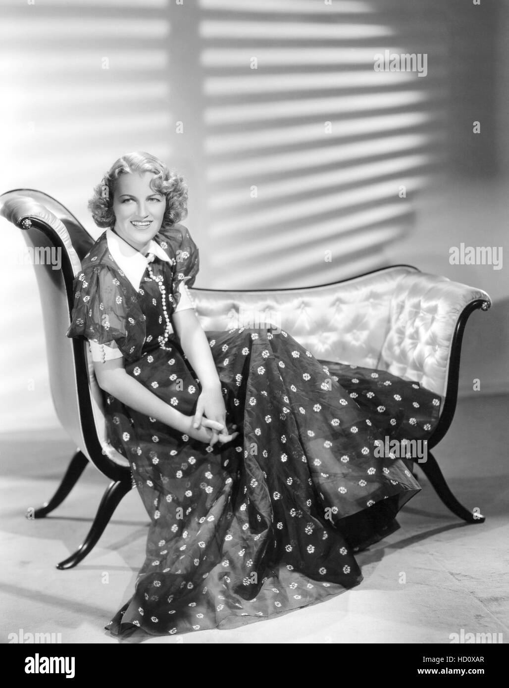 Gracie Fields wearing Prussian blue marquisette dinner frock, ca. late ...