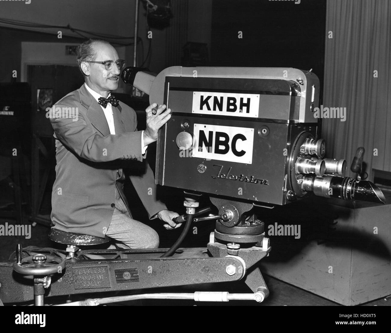 GROUCHO MARX poses with a television camera during production of YOU ...