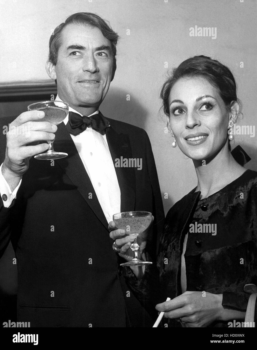 GREGORY PECK and wife VERONIQUE PECK at a fashion show toast their host ...