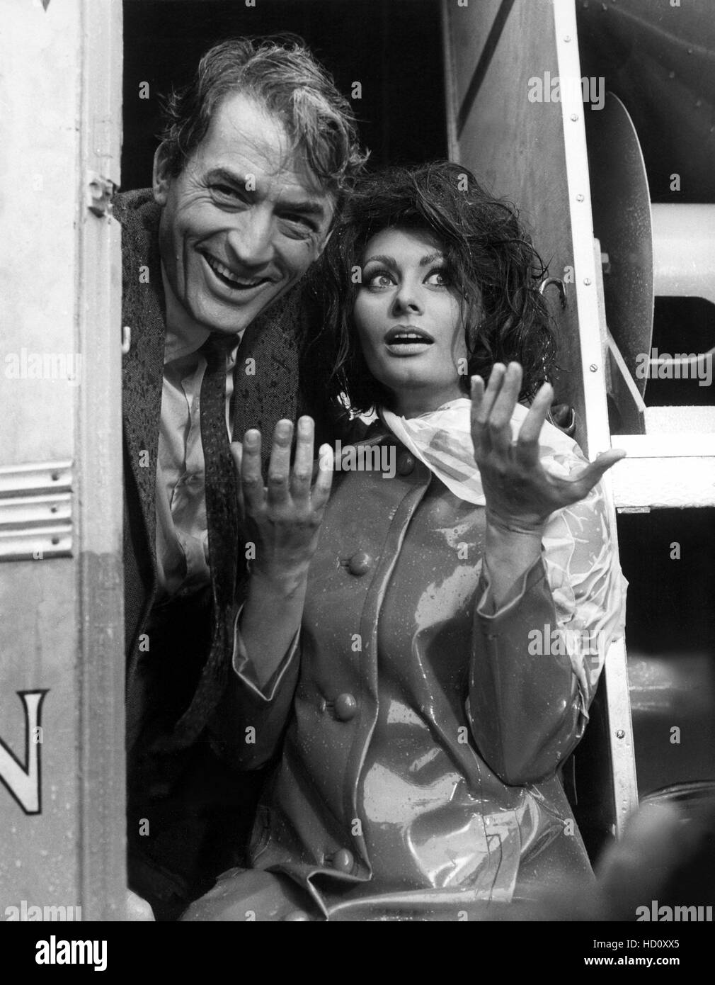 GREGORY PECK and SOPHIA LOREN get caught in an English downpour during ...